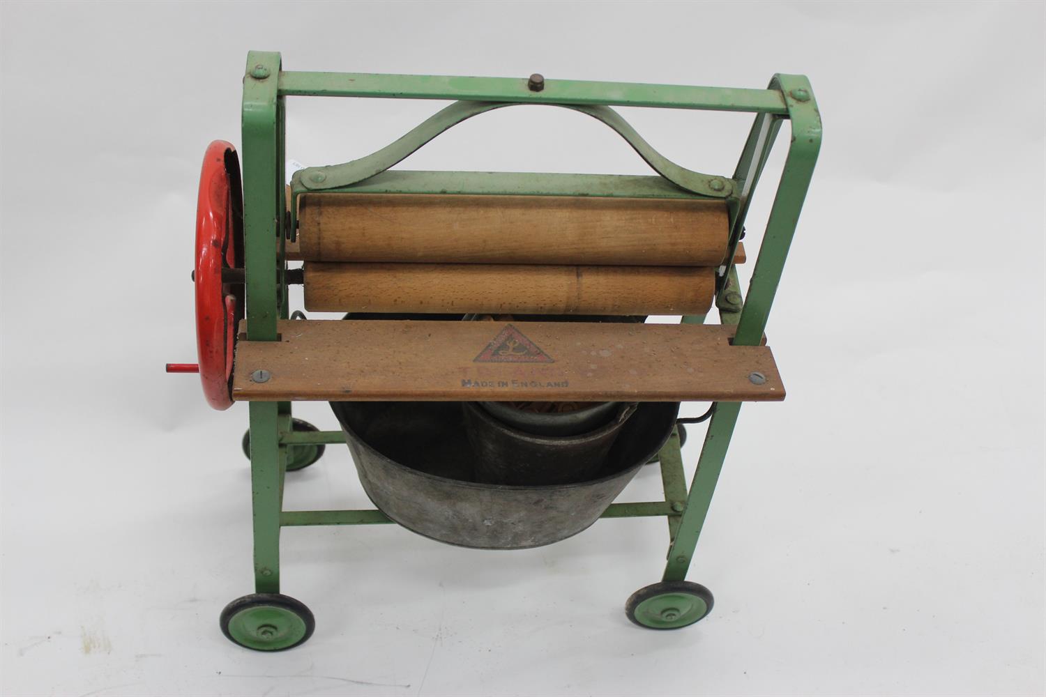 Lot 334 - AN OLD TRI-ANG GREEN PAINTED TOY MANGLE