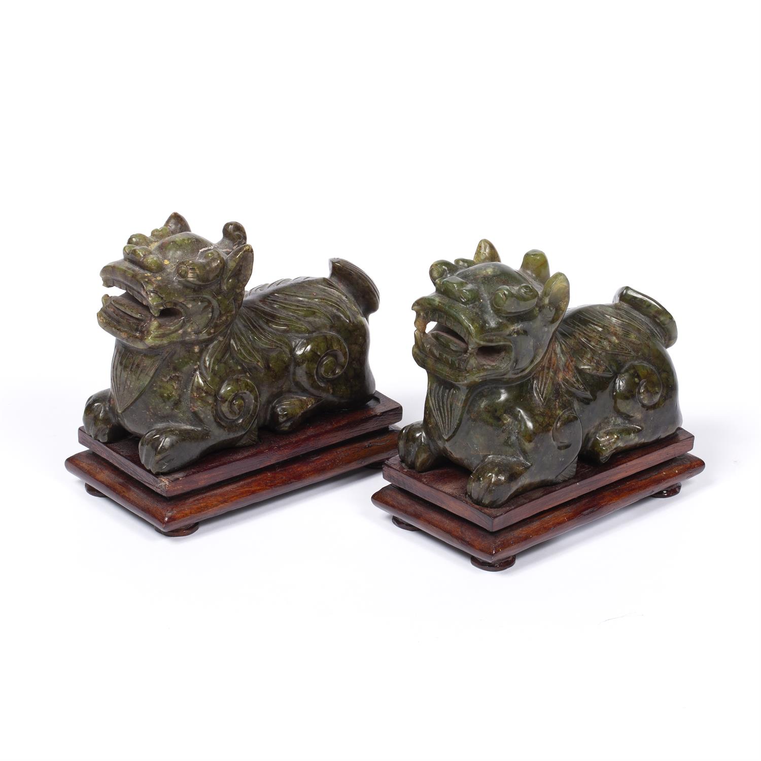 Lot 392 - Pair of carved hardstone dogs of fo