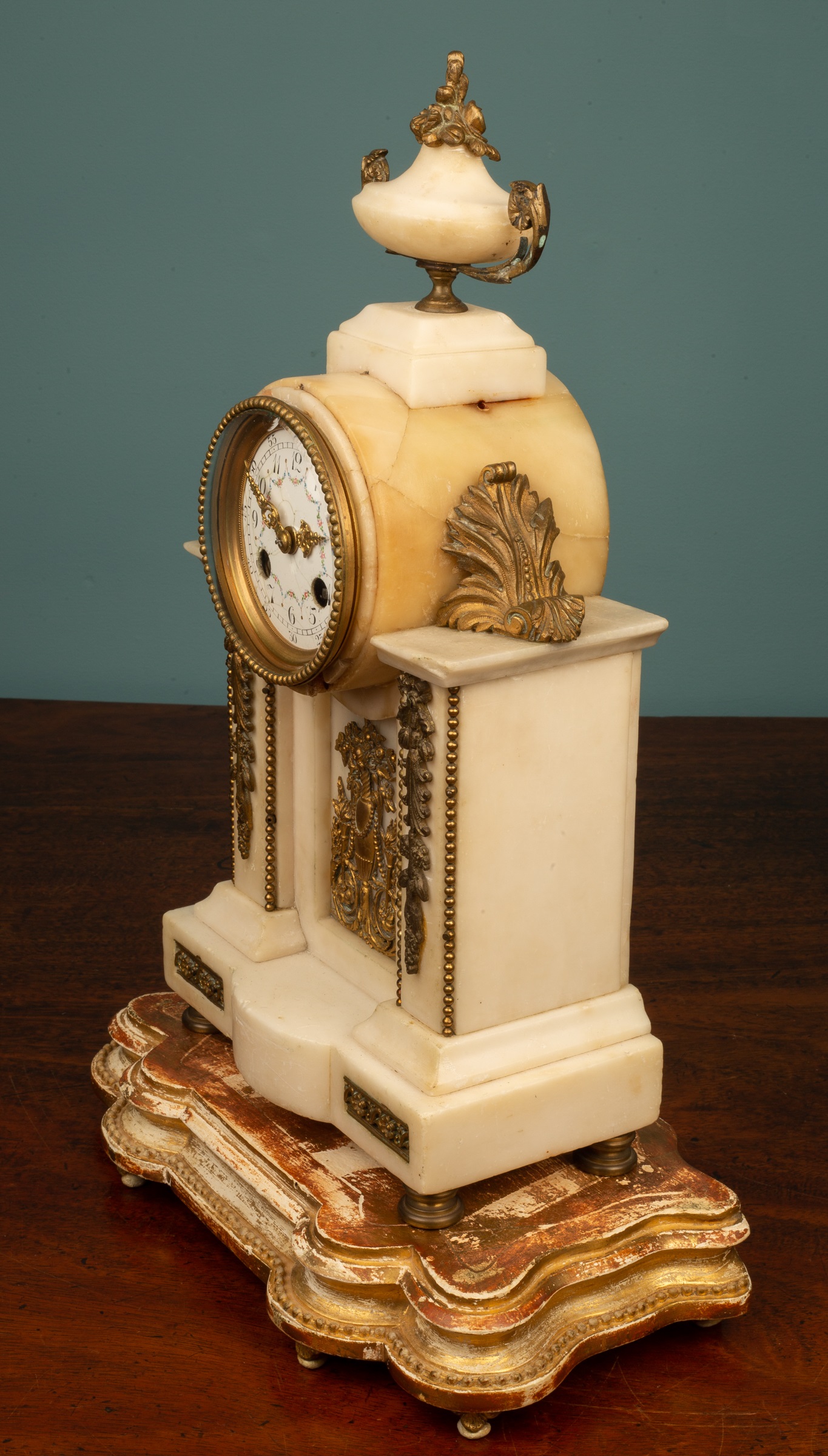 Lot 65 - An antique French alabaster mantel clock,