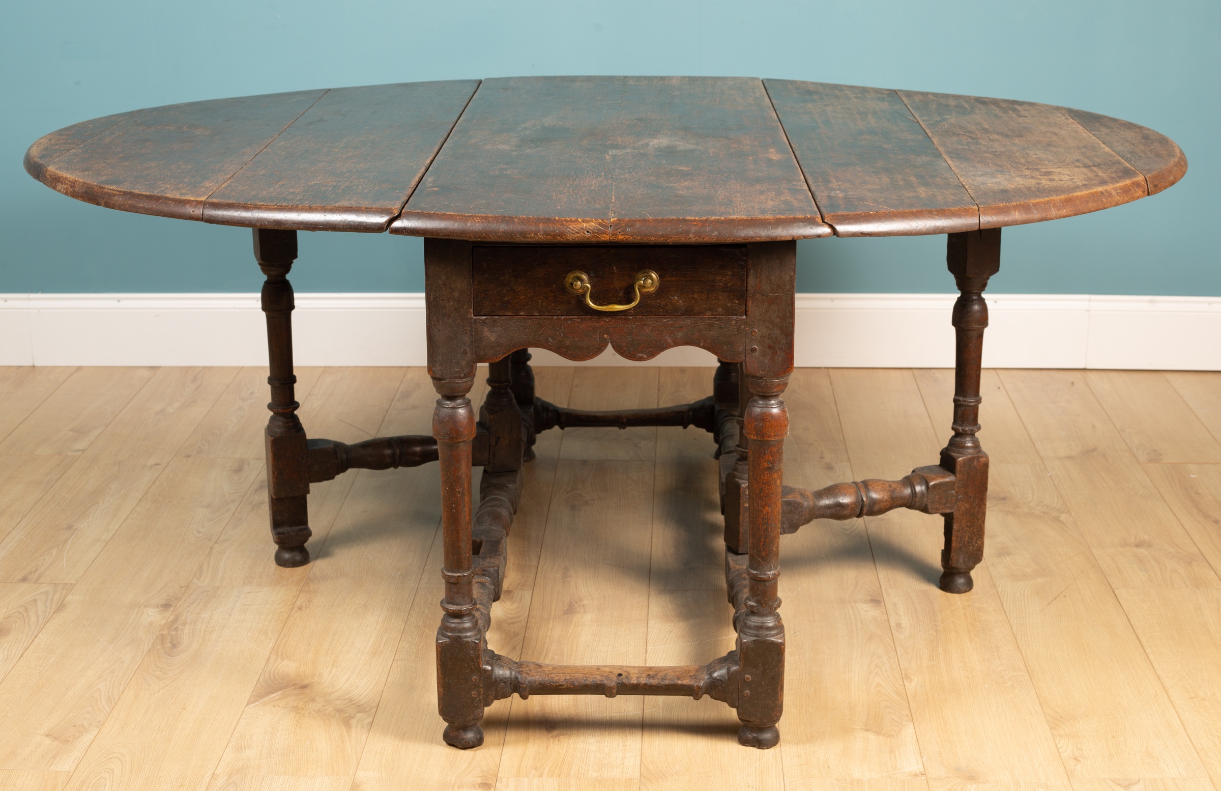 Lot 228 - An 18th century eight-seater oak oval gate