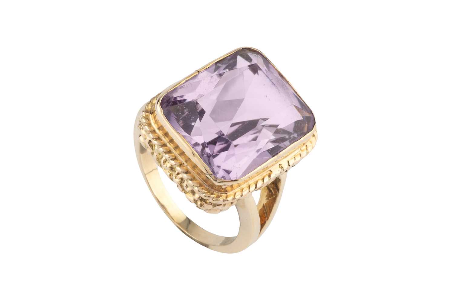 Lot 75 - An amethyst single stone ring, the
