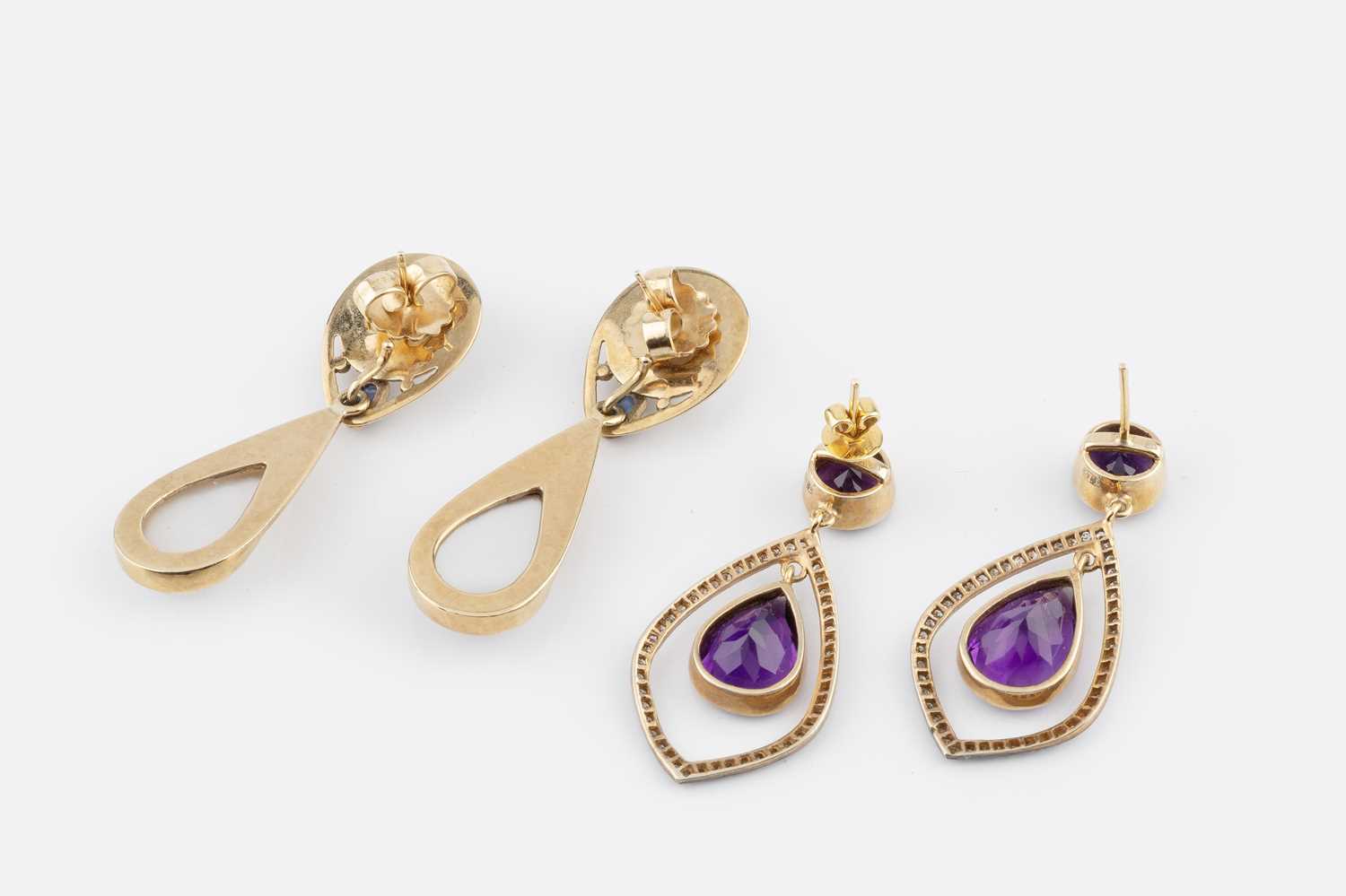 Lot 81 - A pair of amethyst and diamond ear pendants,