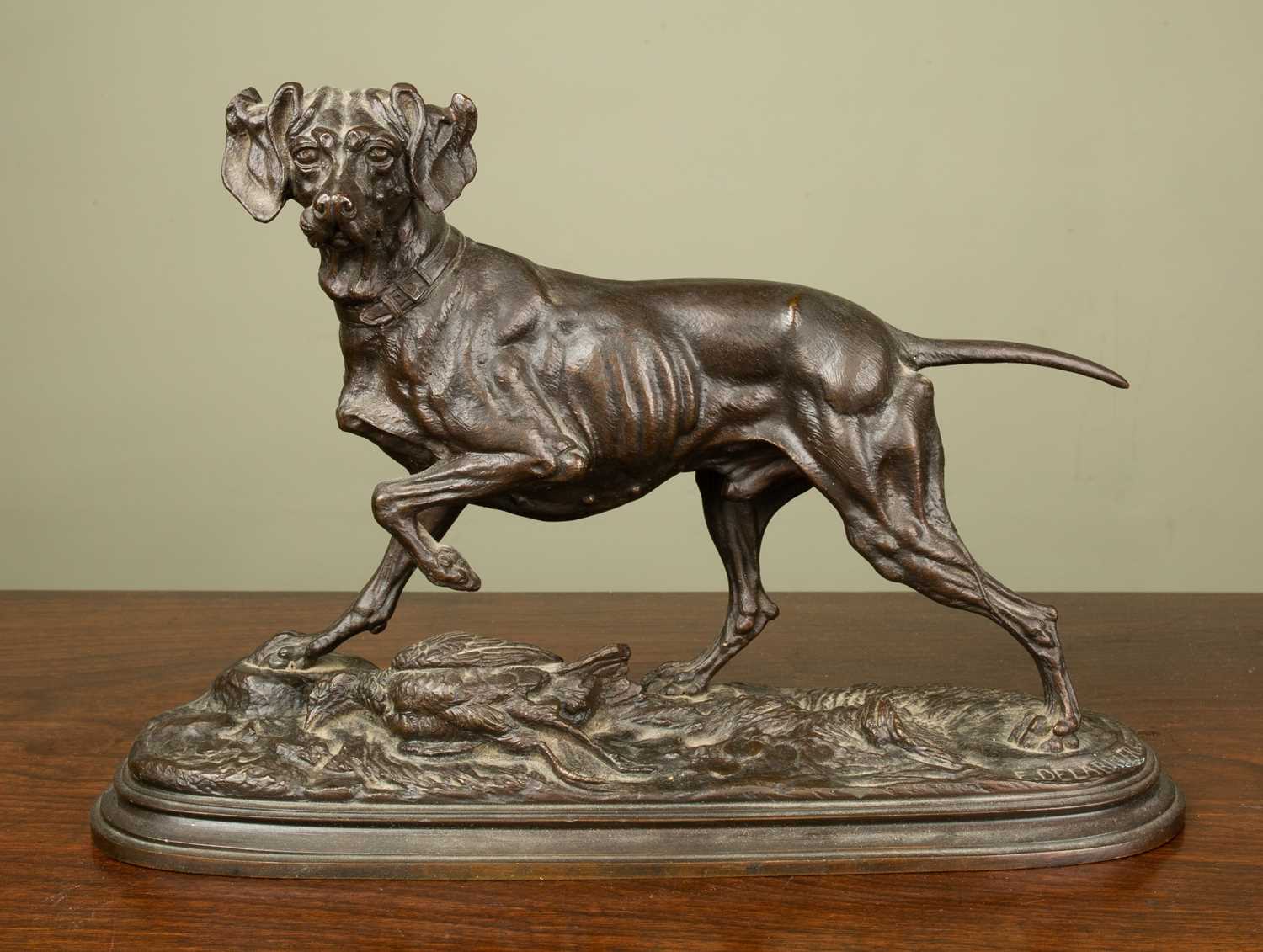 Lot 73 - A bronze statue of a hunting dog hovering